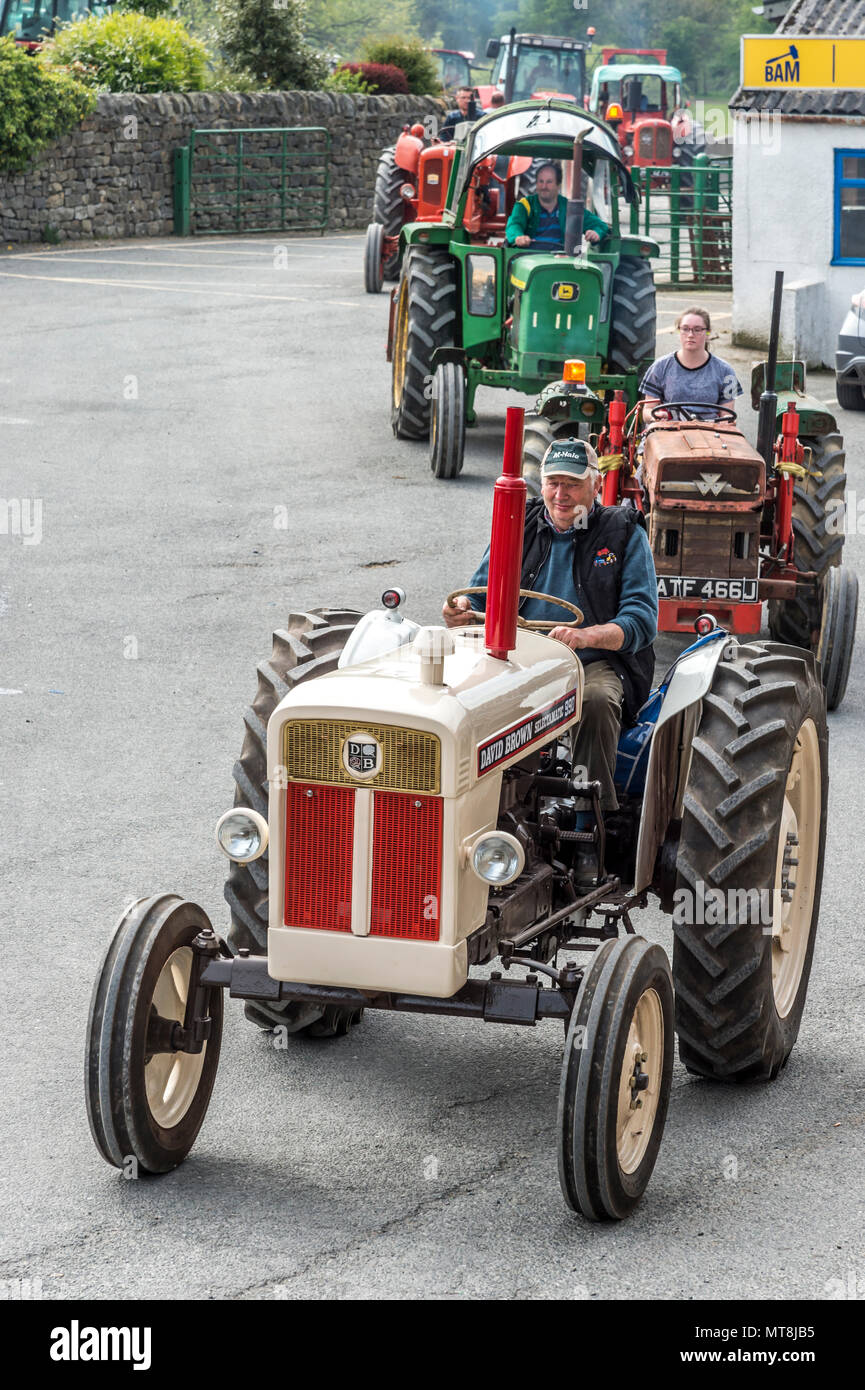 The annual charity vintage tractor rally leaving the live-stock auction ...