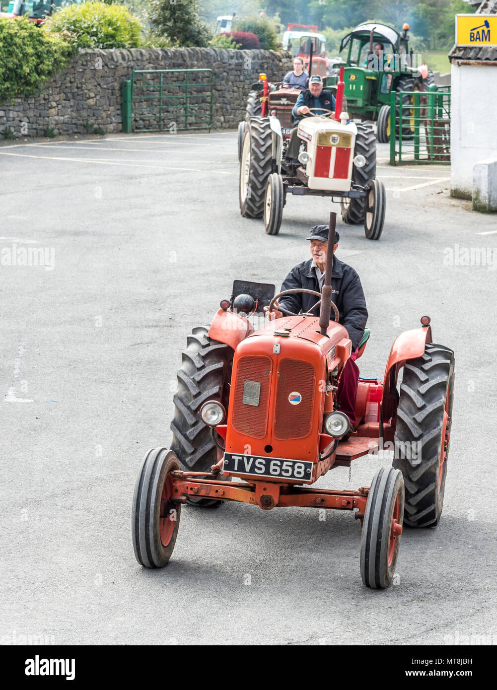The annual charity vintage tractor rally leaving the live-stock auction ...