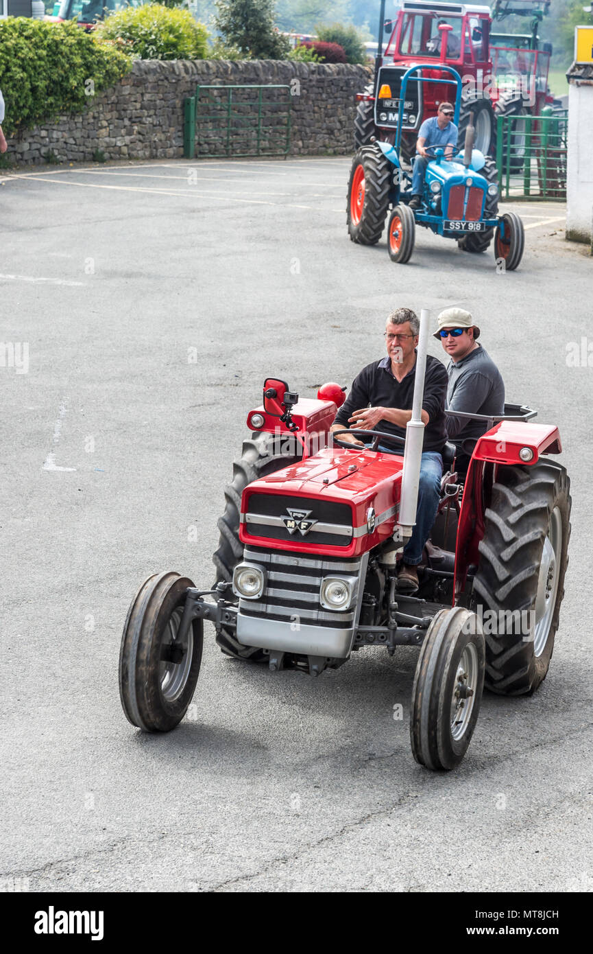 The annual charity vintage tractor rally leaving the live-stock auction ...
