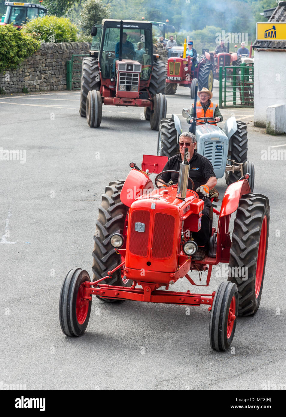 The annual charity vintage tractor rally leaving the live-stock auction ...