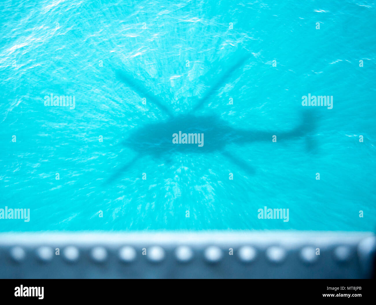 180511-N-OH958-0144 ATLANTIC OCEAN (May 11, 2018) A reflection of an MH ...