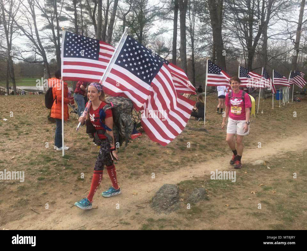 Kimberly Mauro and her rucking partner Diane cross the finish line at ...