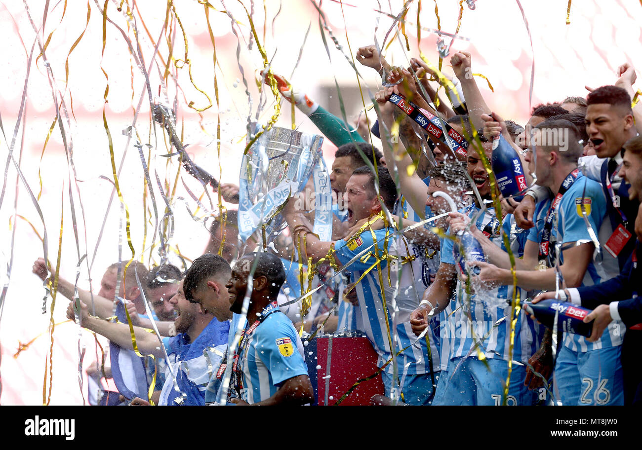 Coventry City's Michael Doyle (centre) celebrates with the trophy and ...