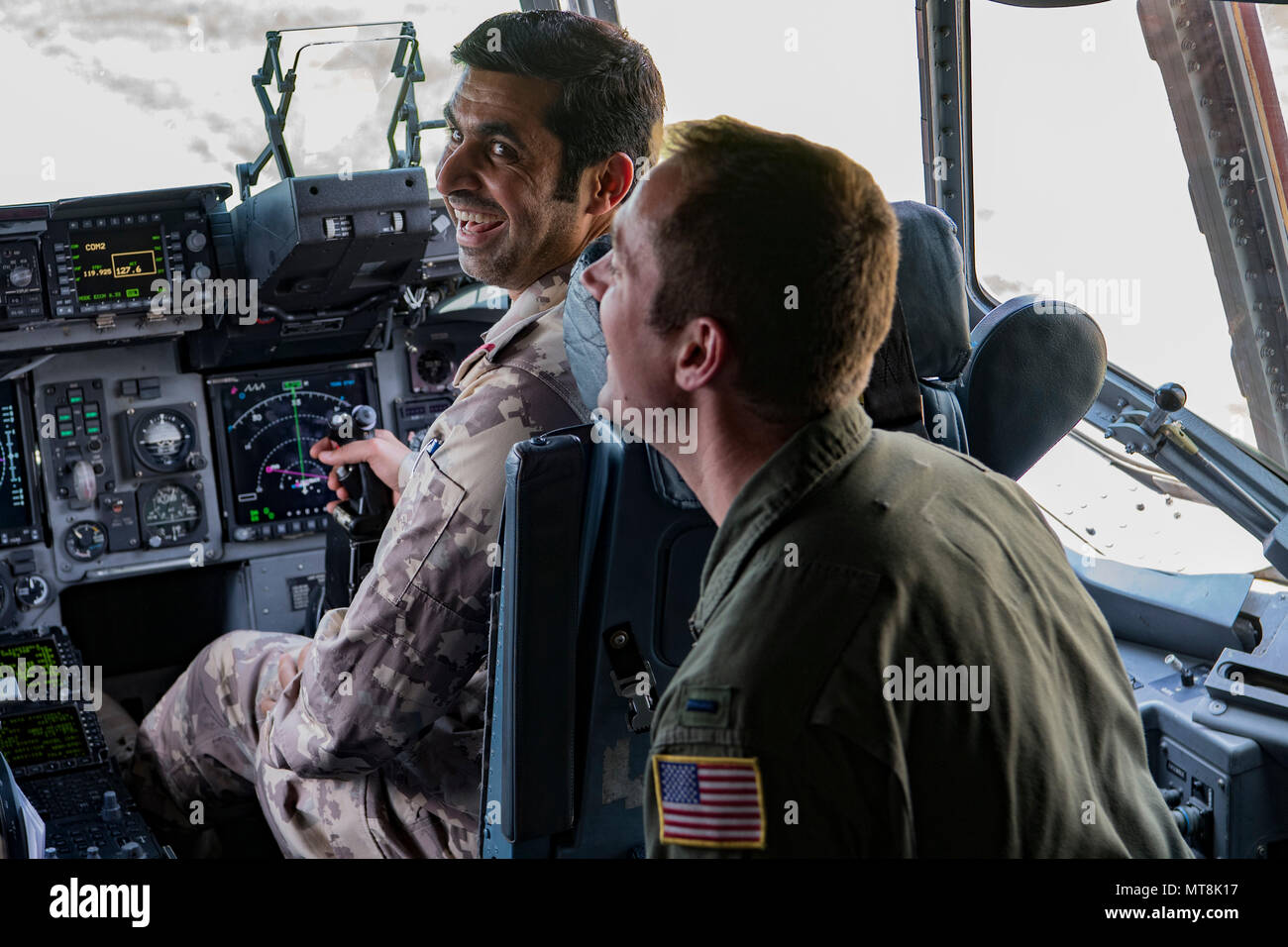 Brig. Gen. Yousef Al Kuwari, the Qatar Defense Attaché, laughs with a ...