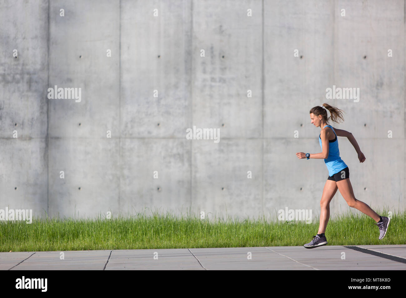 Female Urban Runner Stock Photo - Alamy