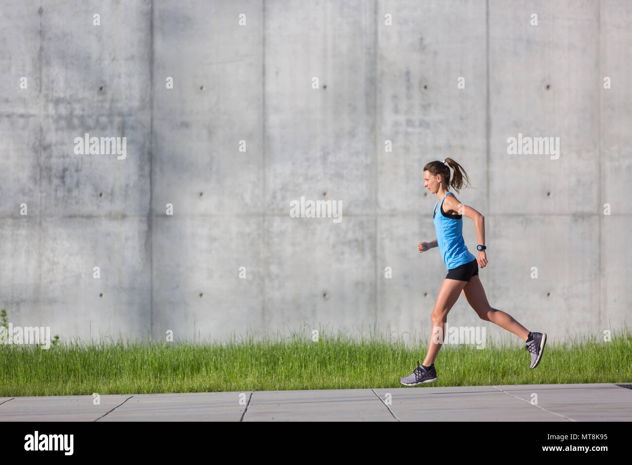 Female Urban Runner Stock Photo - Alamy