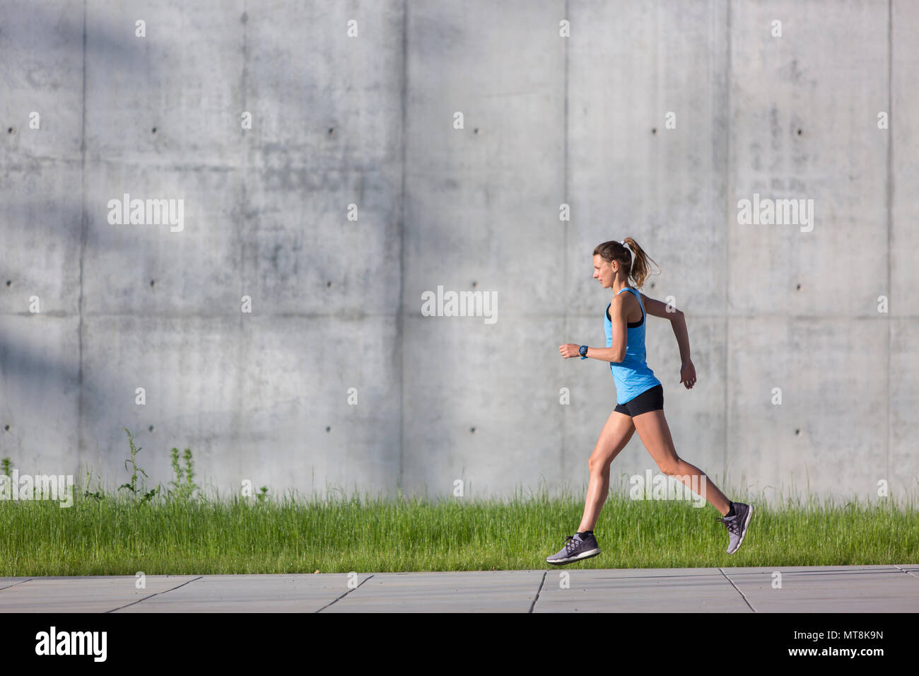Female Urban Runner Stock Photo - Alamy