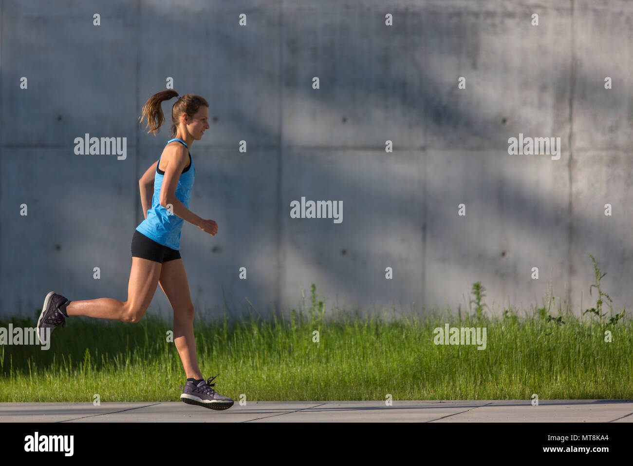 Female Urban Runner Stock Photo - Alamy