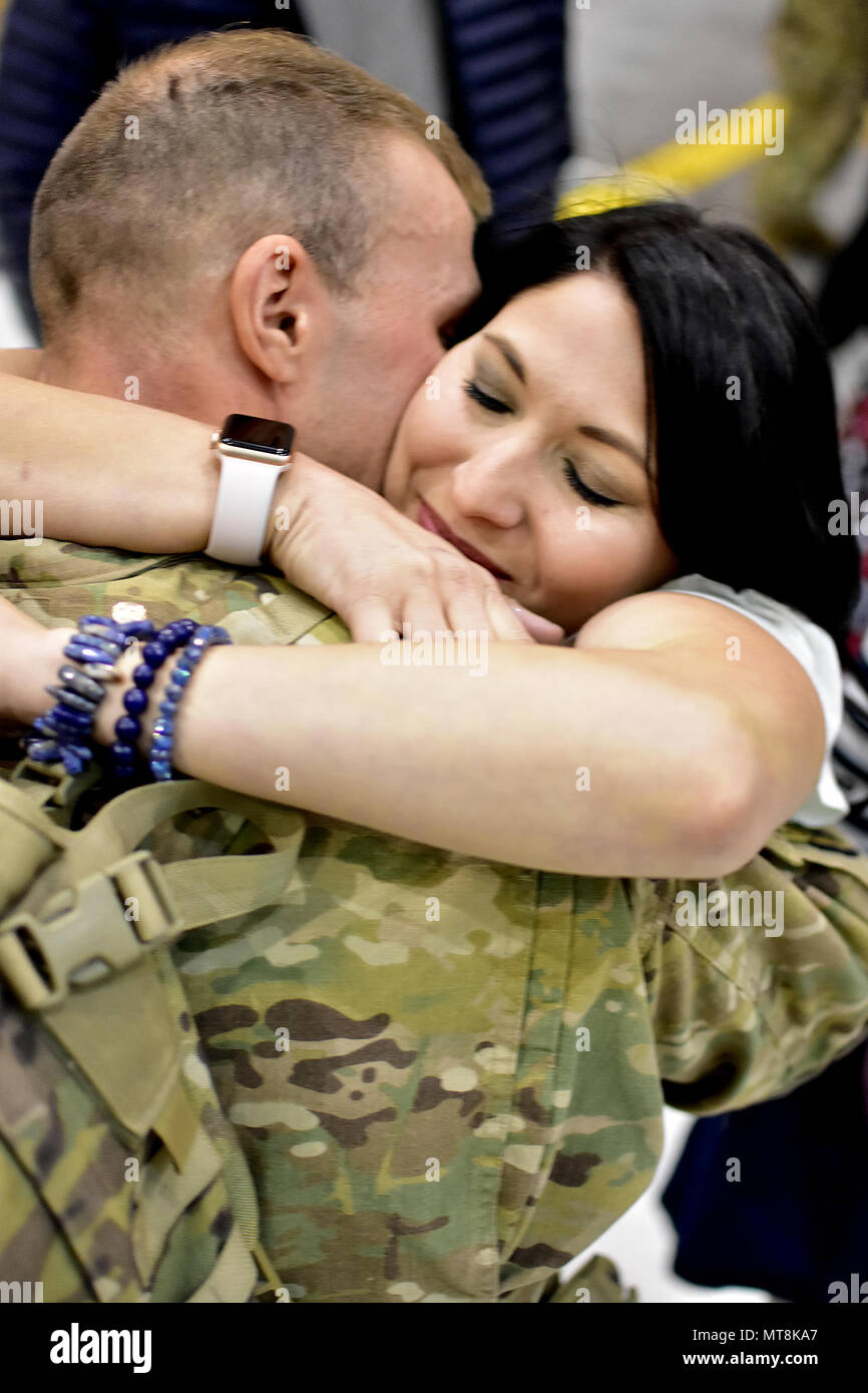 Brittany Rimgale reunites with her husband, Staff Sgt. Tim Rimgale, at ...