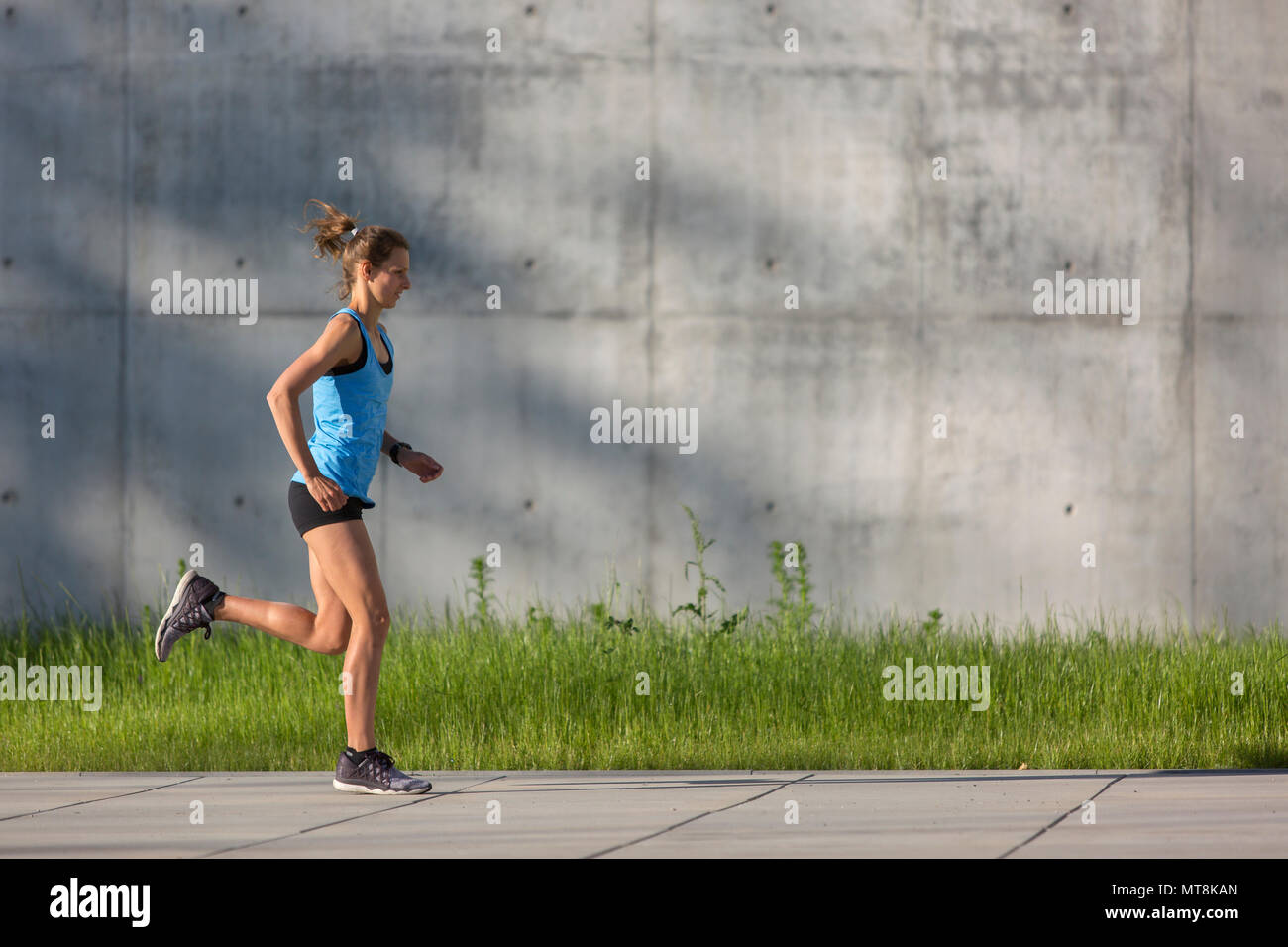 Female Urban Runner Stock Photo - Alamy