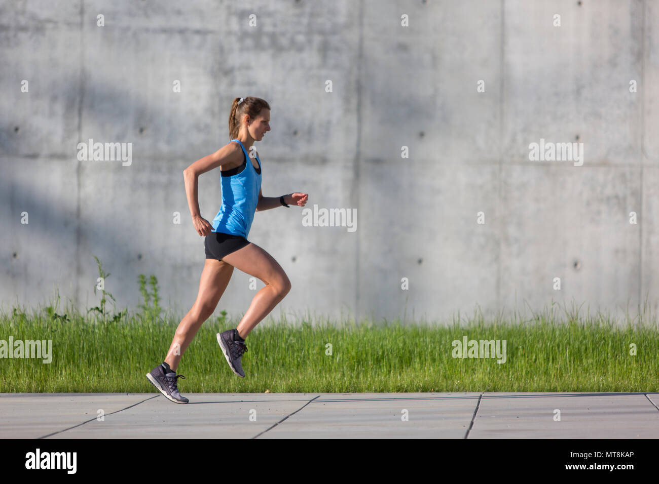 Female Urban Runner Stock Photo - Alamy