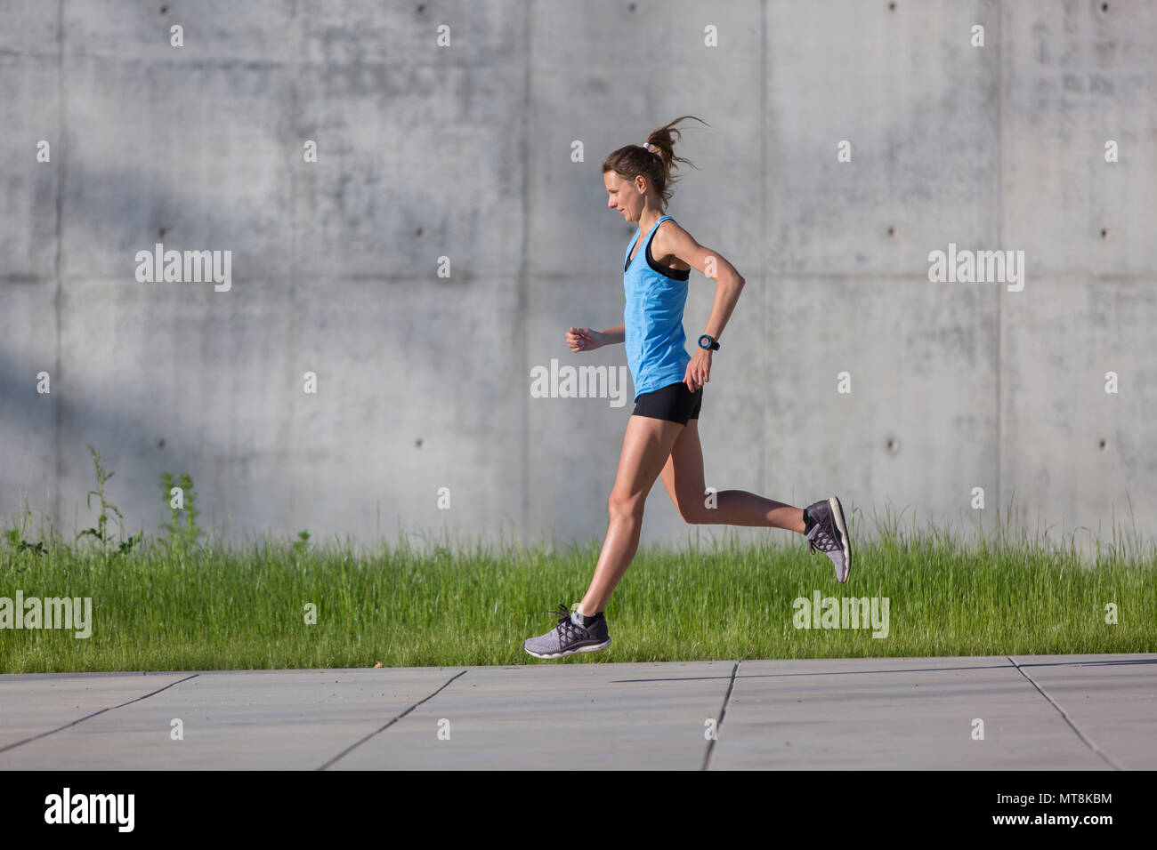 Female Urban Runner Stock Photo - Alamy
