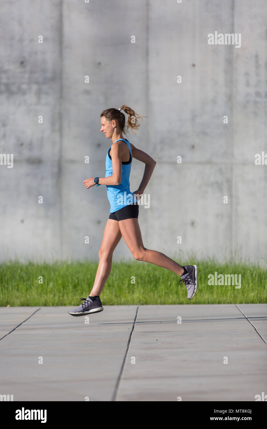 Female Urban Runner Stock Photo - Alamy
