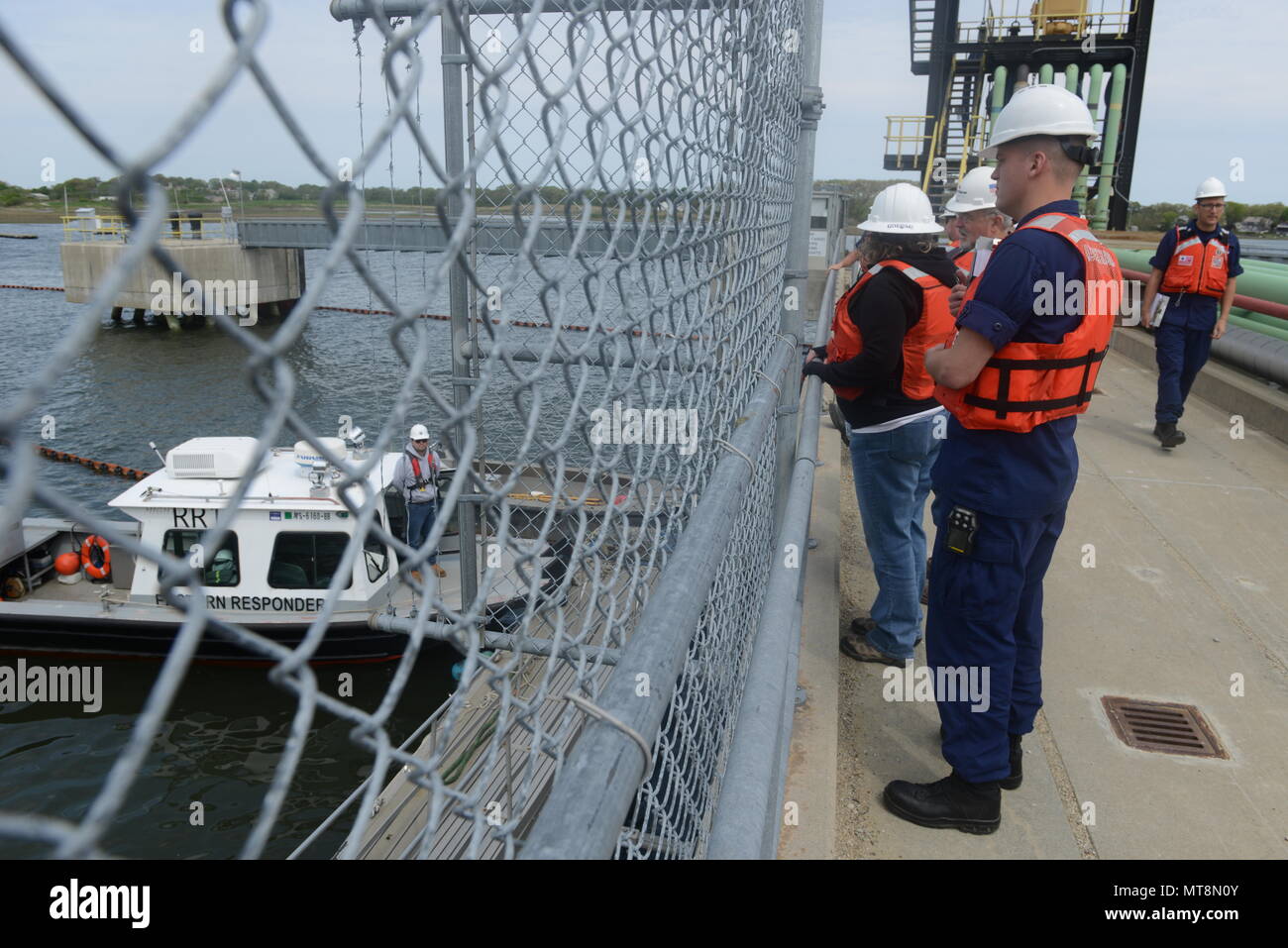 Petty Officer 3rd Class Hayden Hunt and Petty Officer 1st Class Adam ...