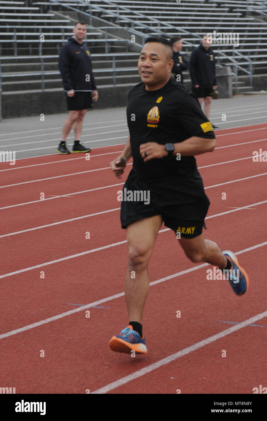 Command Sgt. Maj. Walter Tagalicud, the I Corps Command Sgt. Maj., runs ...