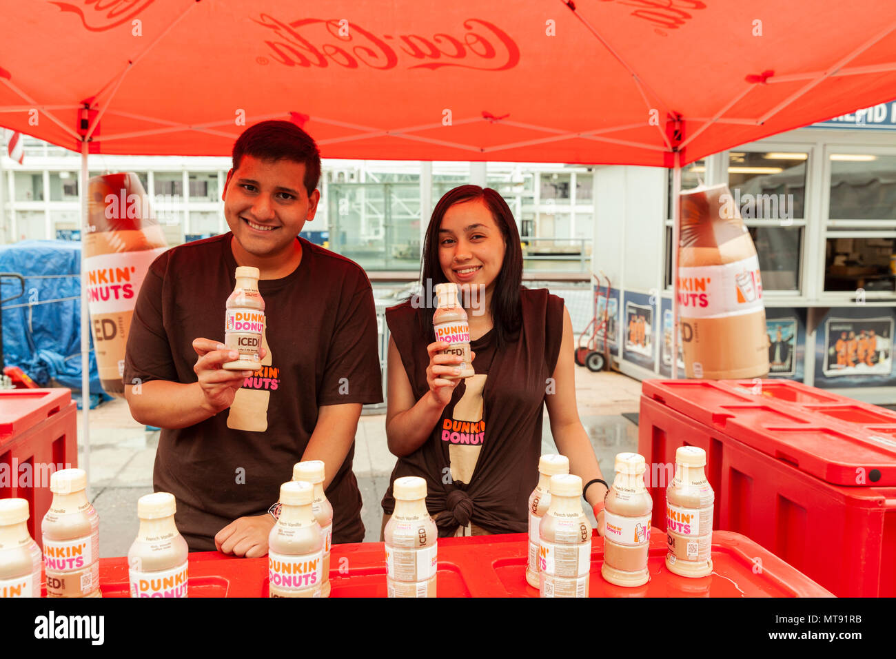 New York, NY - May 28, 2018: Dunkin Donuts representatives display ...