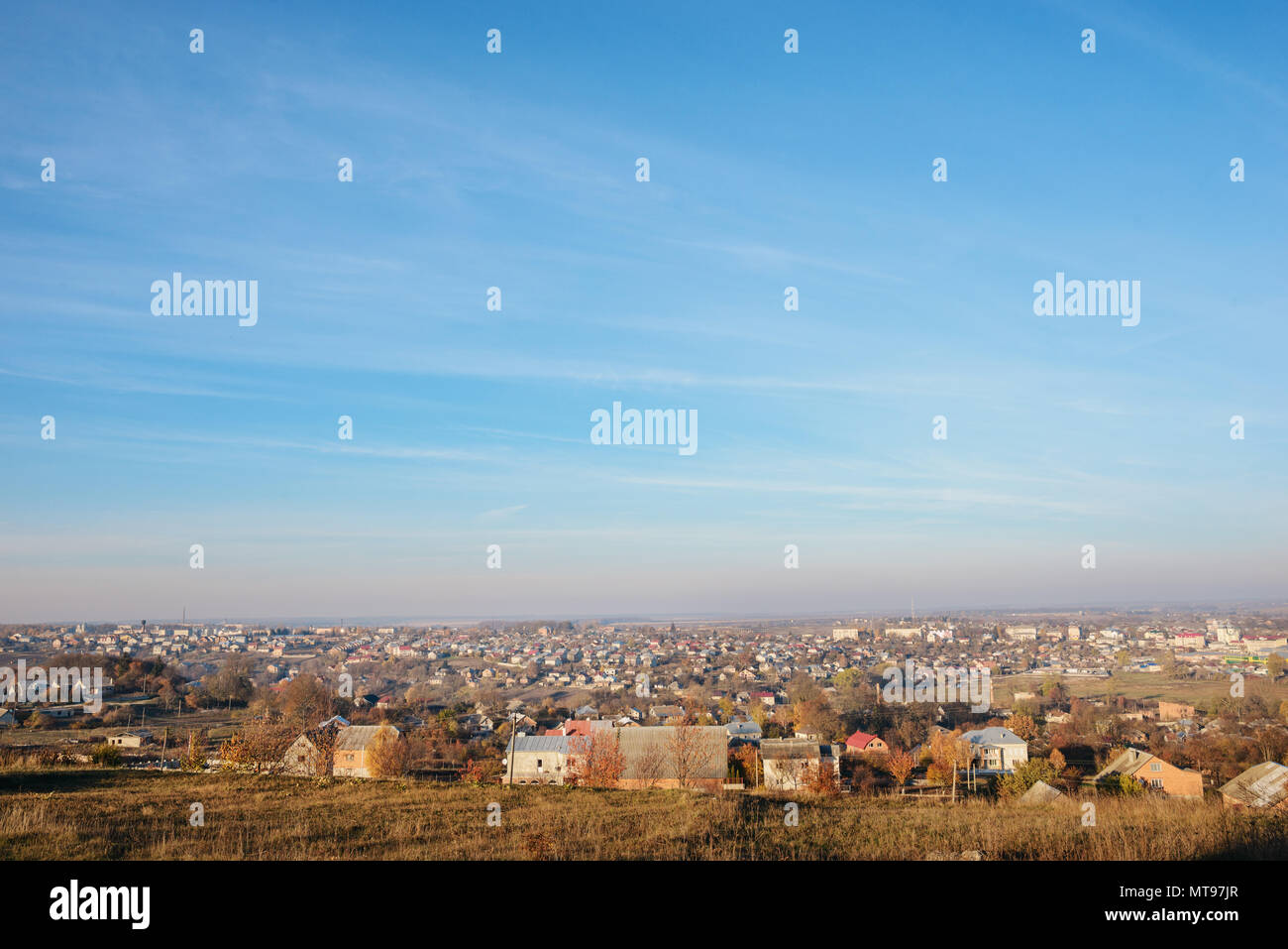 View on the beautiful colorful autumn landscape with a small village ...