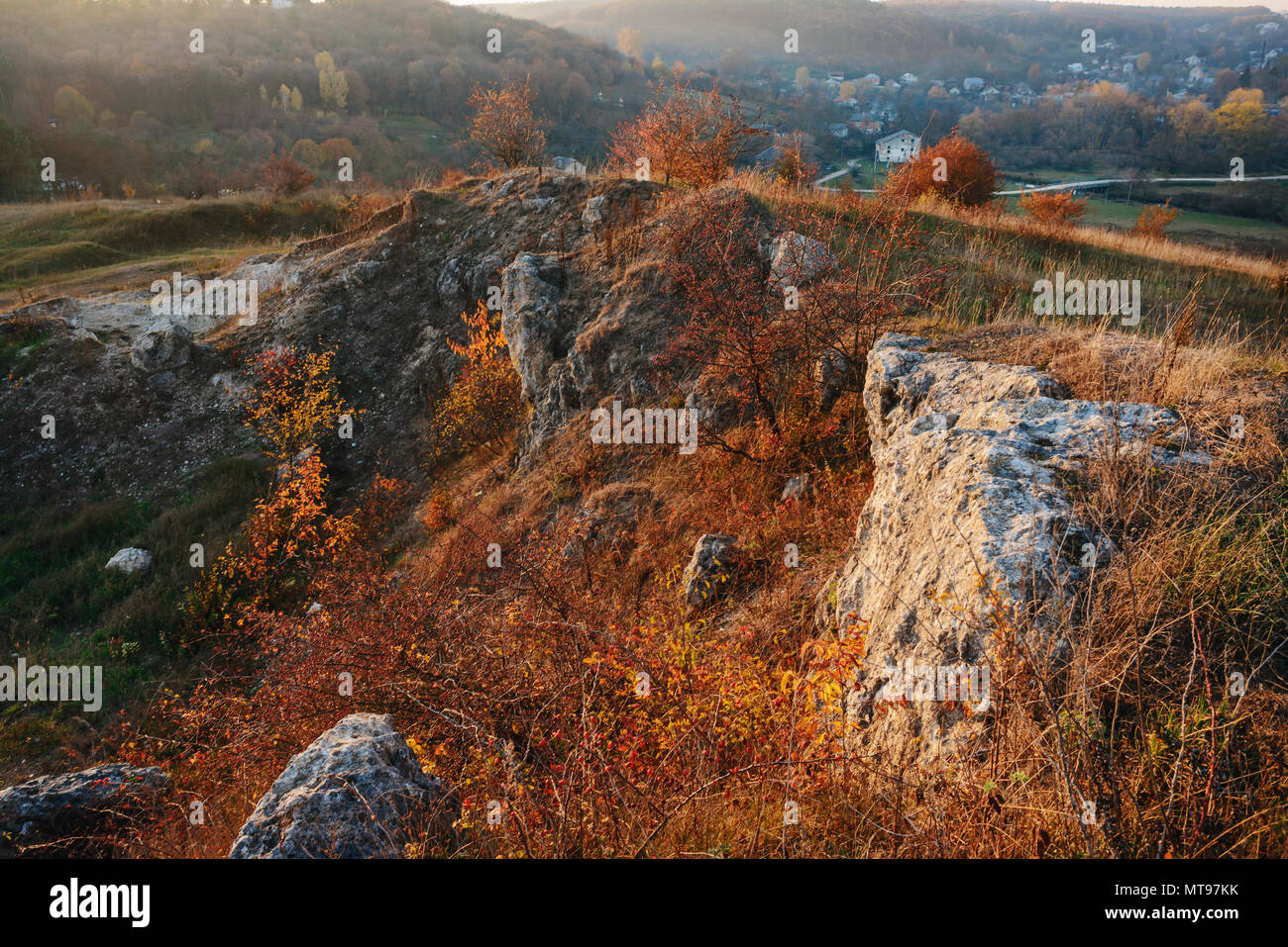 View on the beautiful colorful autumn landscape of the hills with trees ...