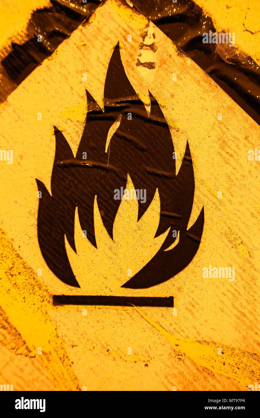 Old warning sign on vehicle with tank for flammable liquid background ...