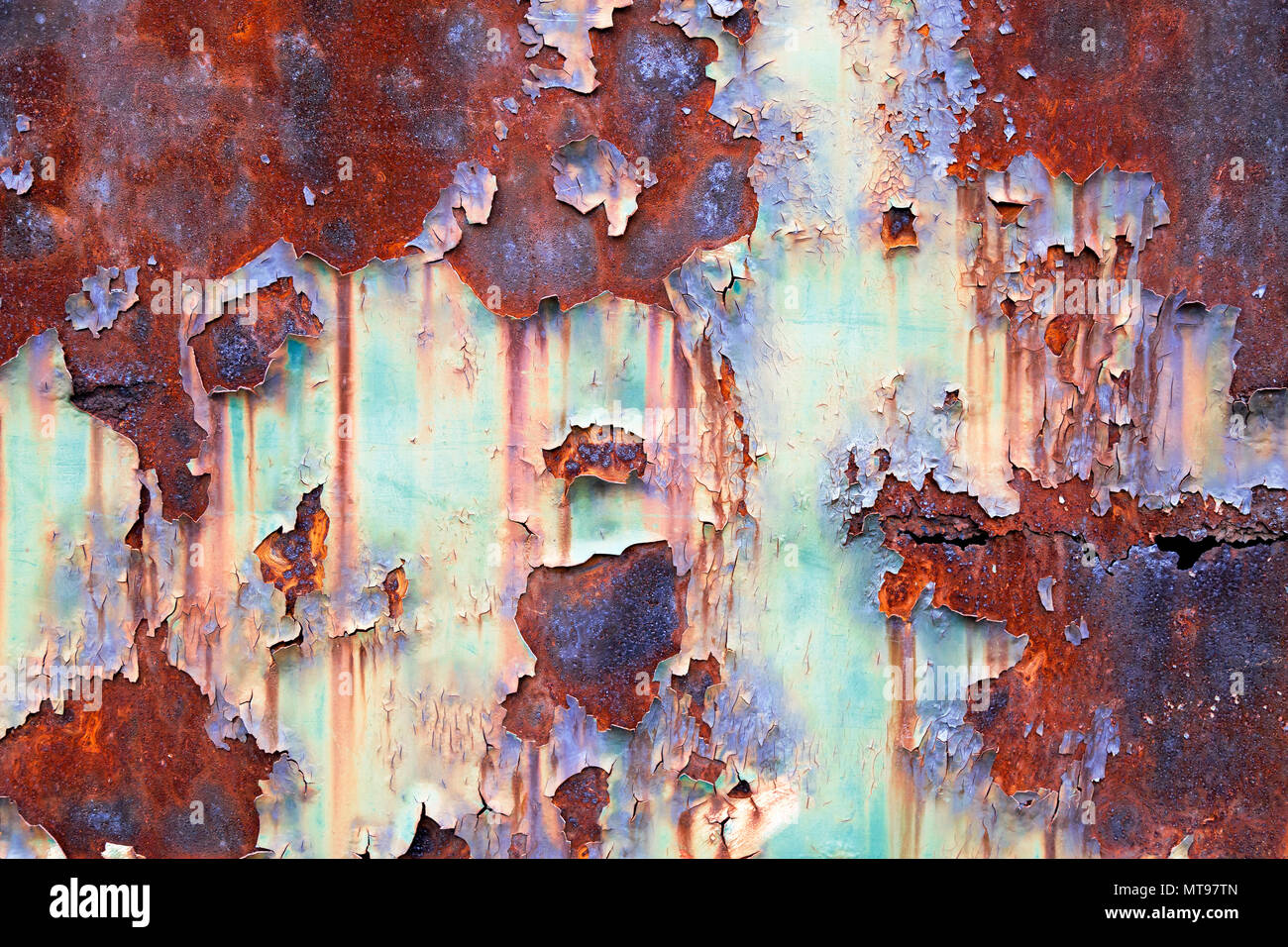 Peeling and cracked paint of an old rusty train wagon. Metal rust ...