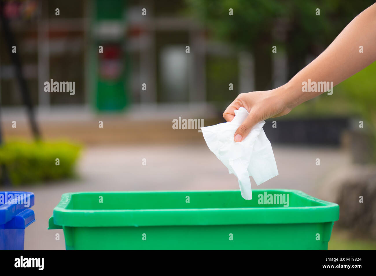 World Environment Day, June 5. Woman hand holding and putting tissue ...