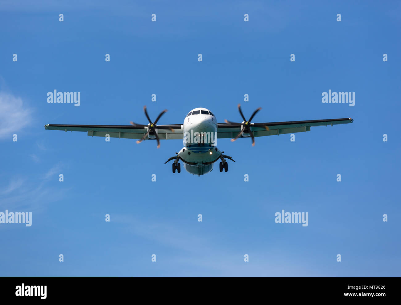 Passenger propeller airplane before landing Stock Photo - Alamy