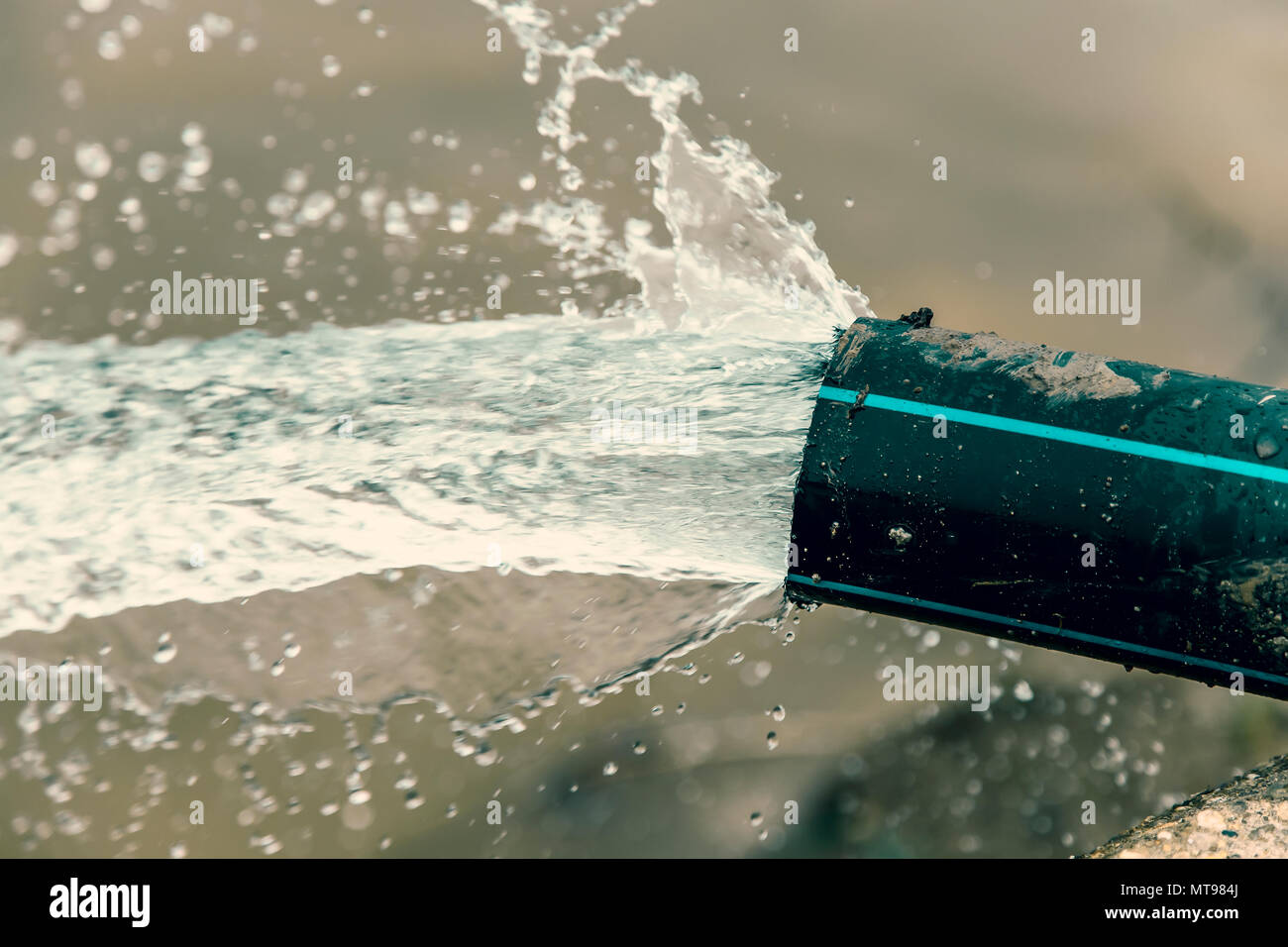 Pumping back flood water into the river from a flooded area, flood ...