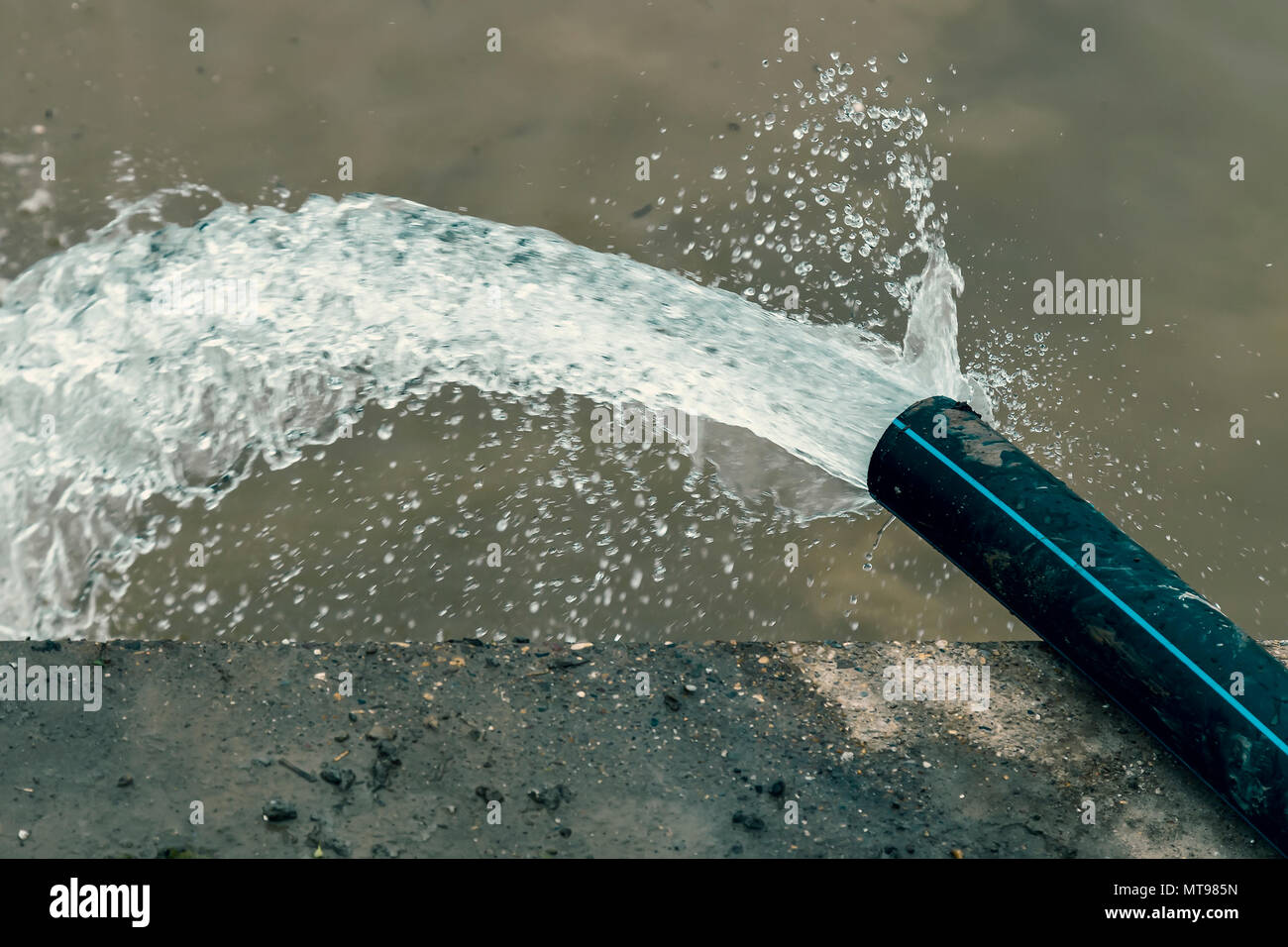Pumping flood water into the river from a flooded area, flood control ...