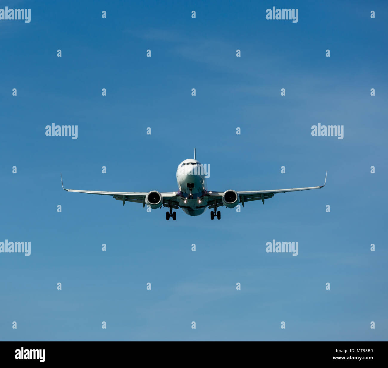Passenger airplane in clouds Stock Photo - Alamy