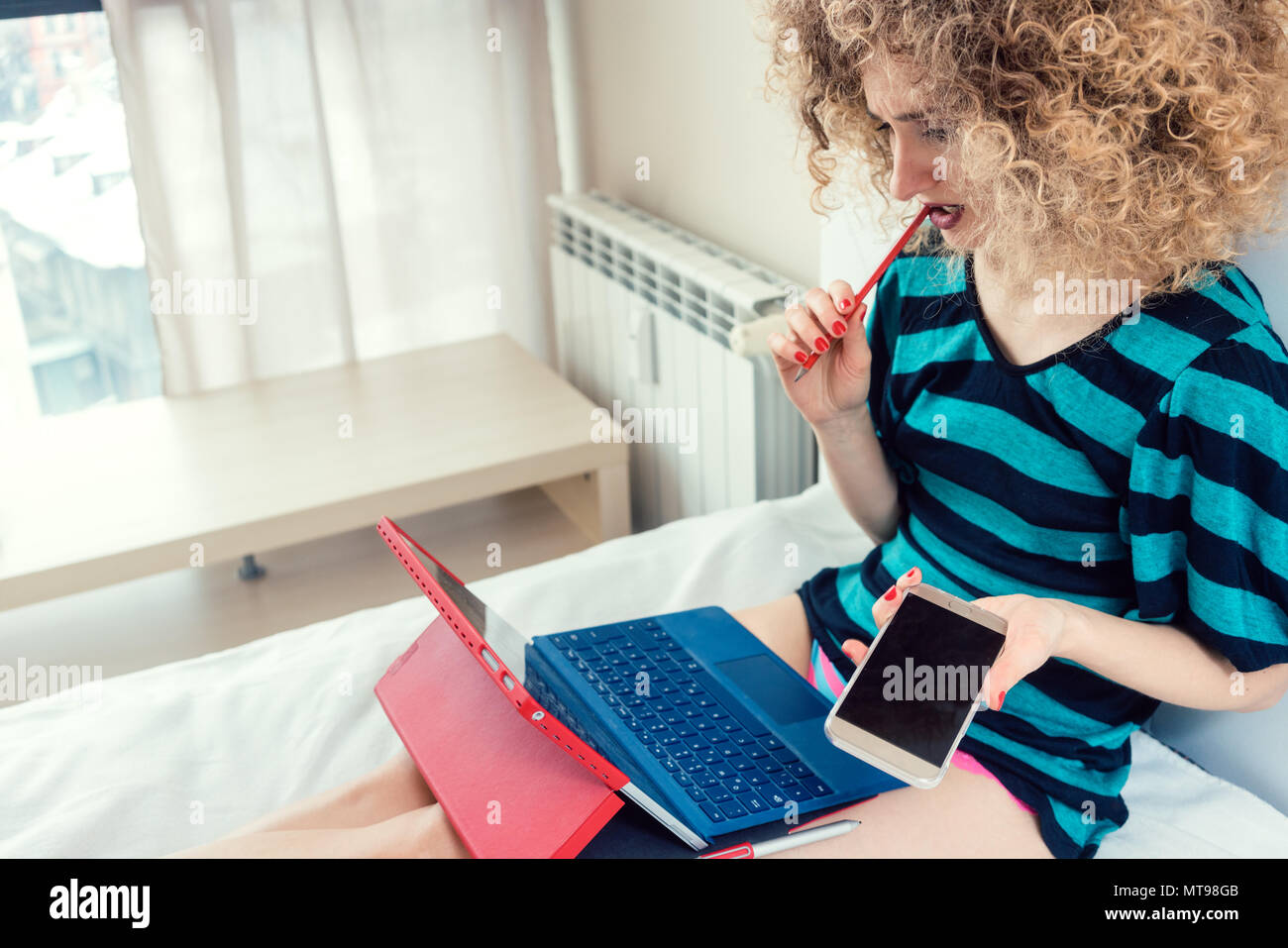 Woman thinking hard working from home Stock Photo - Alamy