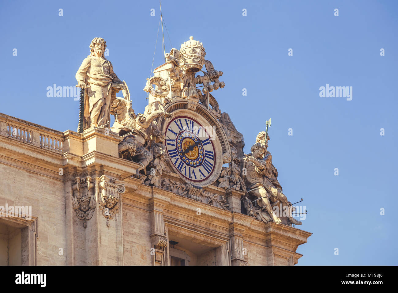 Vatican clock with sculptures on the roof of Basilica of Saint Peter ...