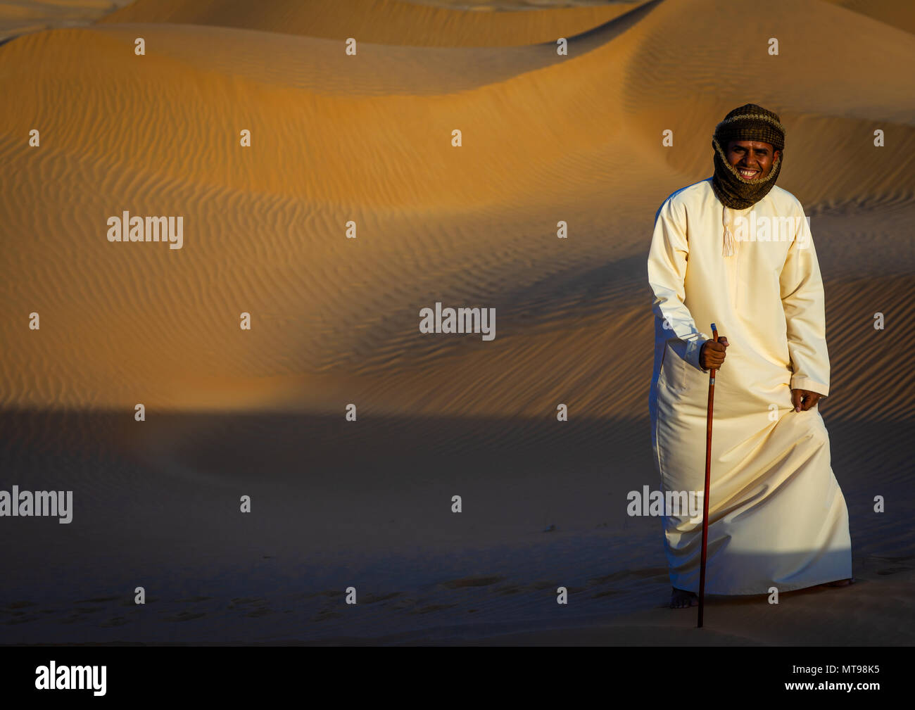 Omani man walking in the rub al khali desert, Dhofar Governorate, Rub ...
