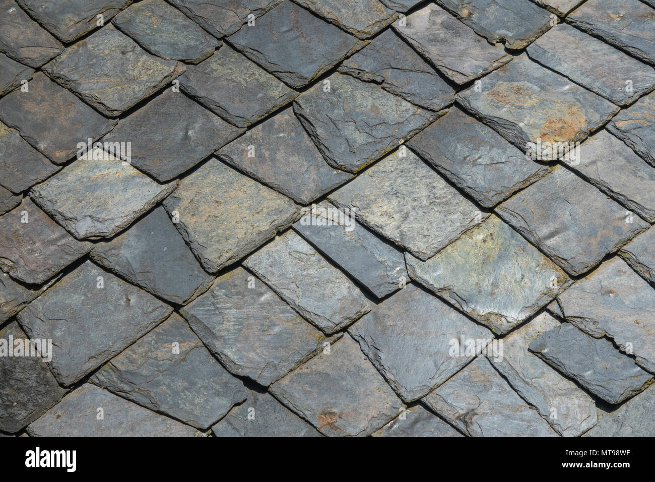 old stone tiles roof background Stock Photo - Alamy