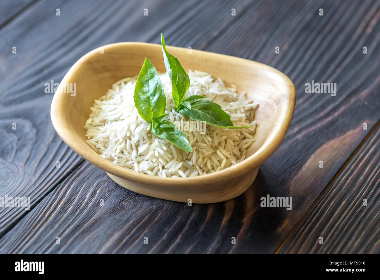 Bowl of uncooked basmati rice Stock Photo - Alamy