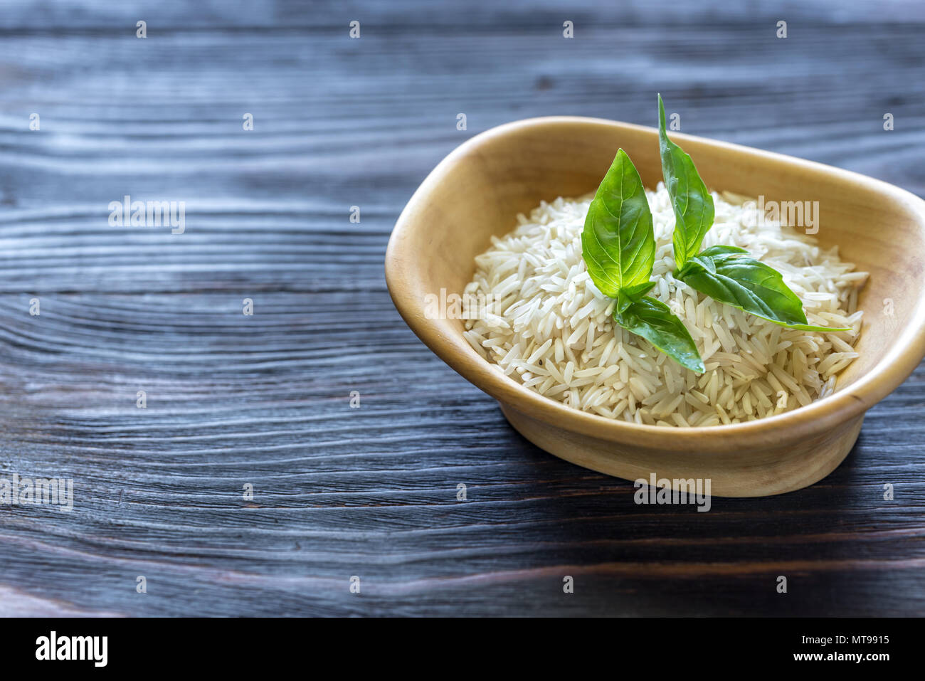 Bowl of uncooked basmati rice Stock Photo - Alamy