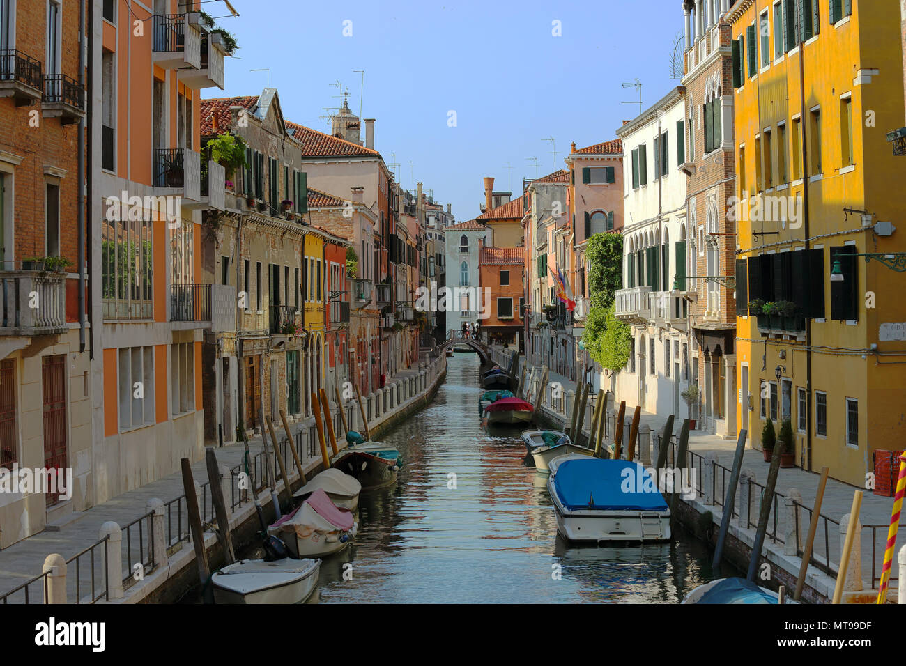 Multi-colored houses on canal in Venice Stock Photo - Alamy
