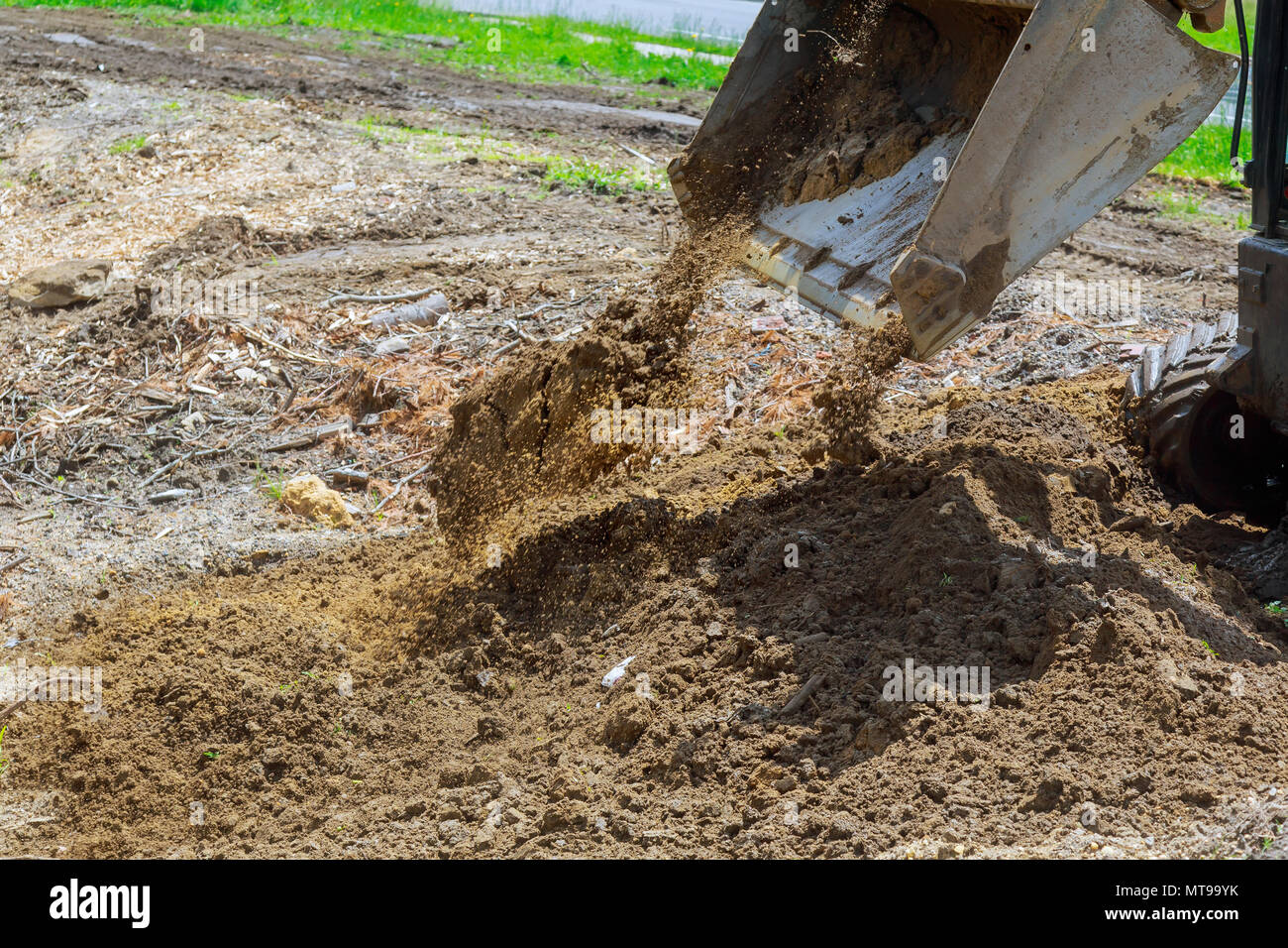 Earth moving by a bulldozer in the construction of a road Stock Photo ...