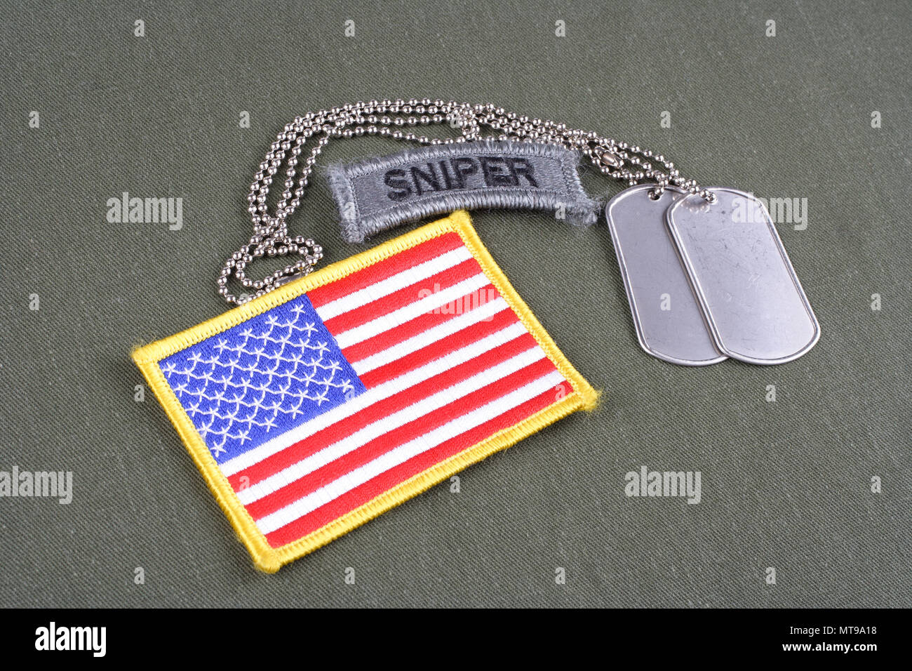 KIEV, UKRAINE - August 21, 2015. US ARMY sniper tab with dog tag and ...