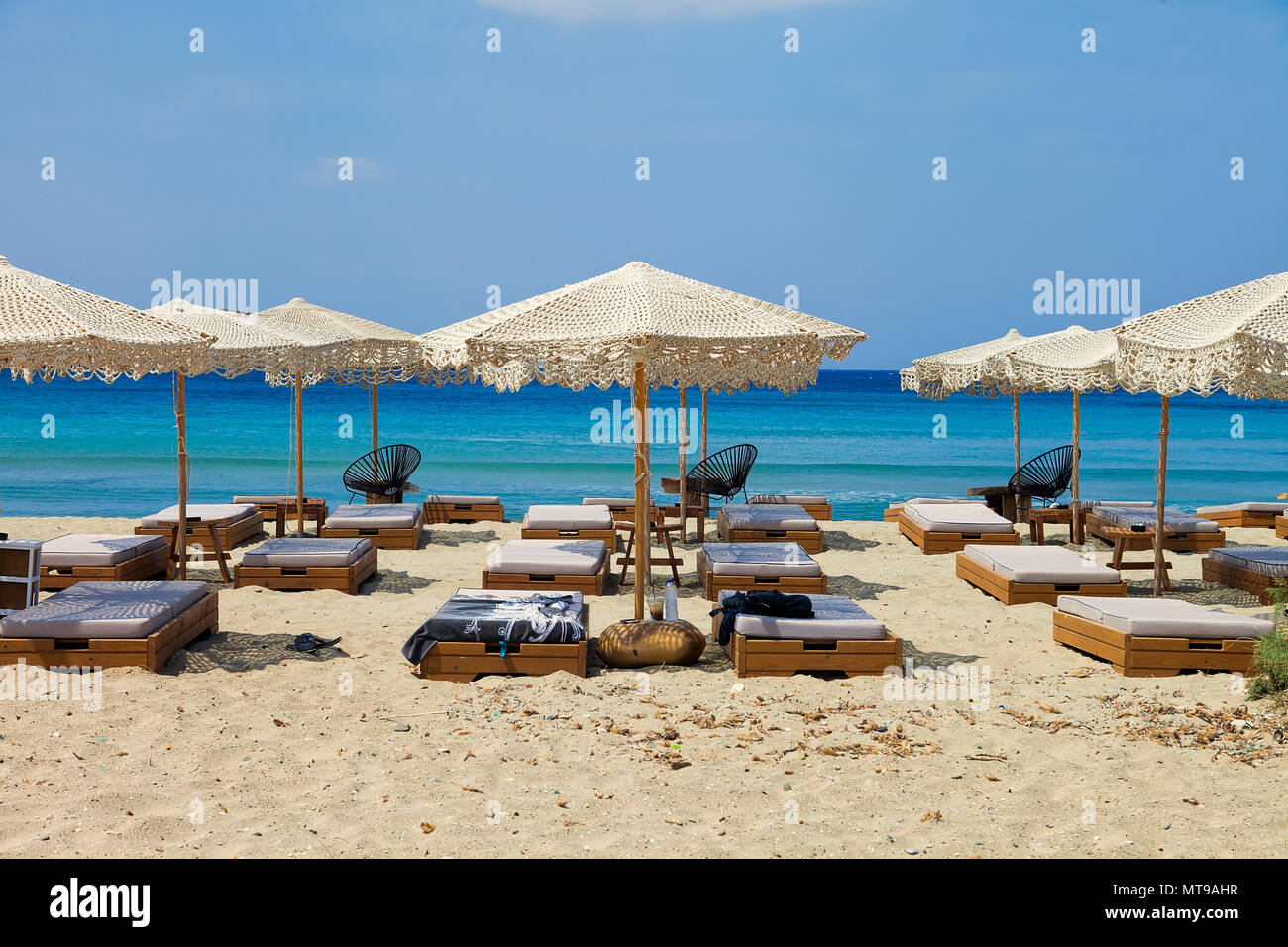 Beach Umbrellas and Deck chairs on Public Beach in Agathopes, in Syros ...