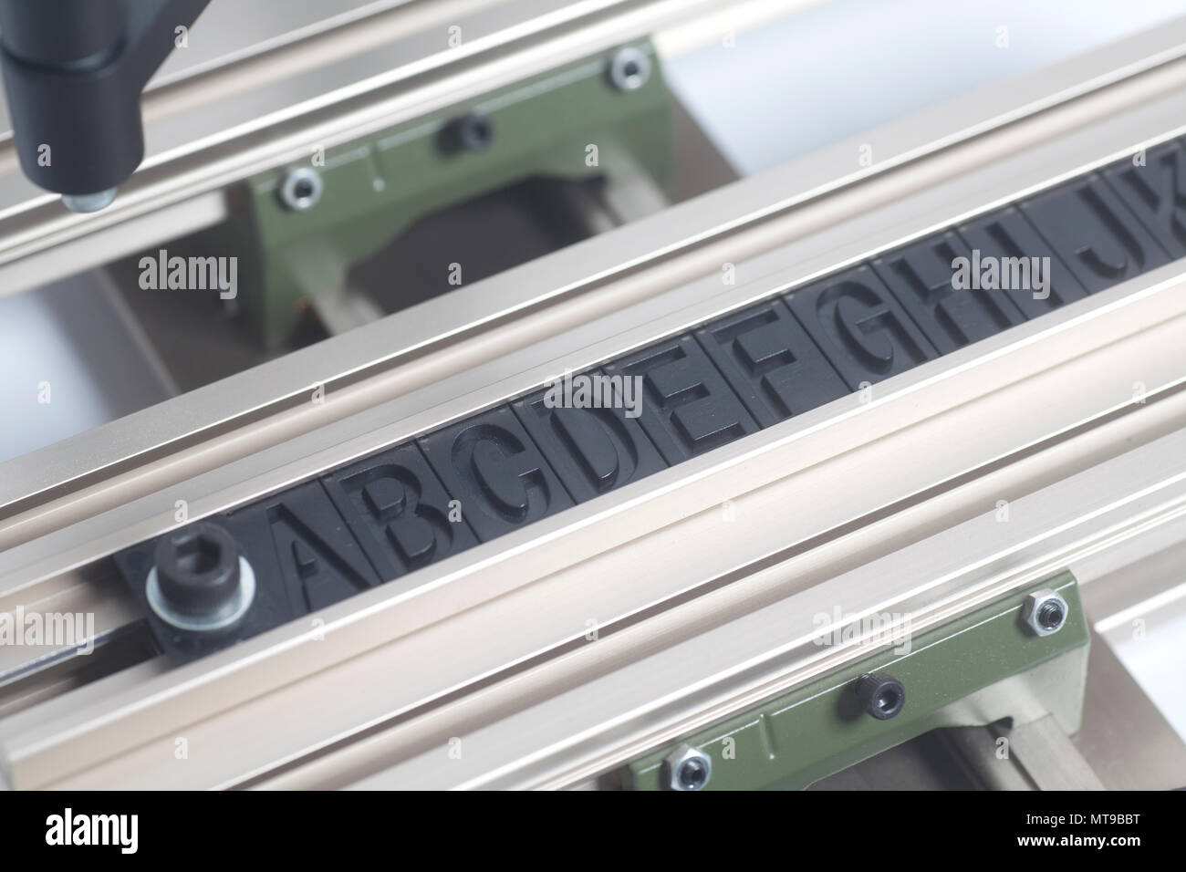Engraving device pantograph with letterpress alphabet close up Stock ...