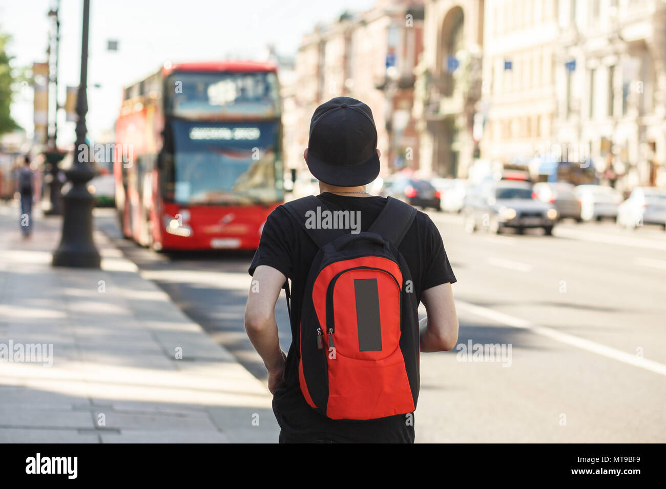 People, travel, tourism and education concept - stylish young man with ...