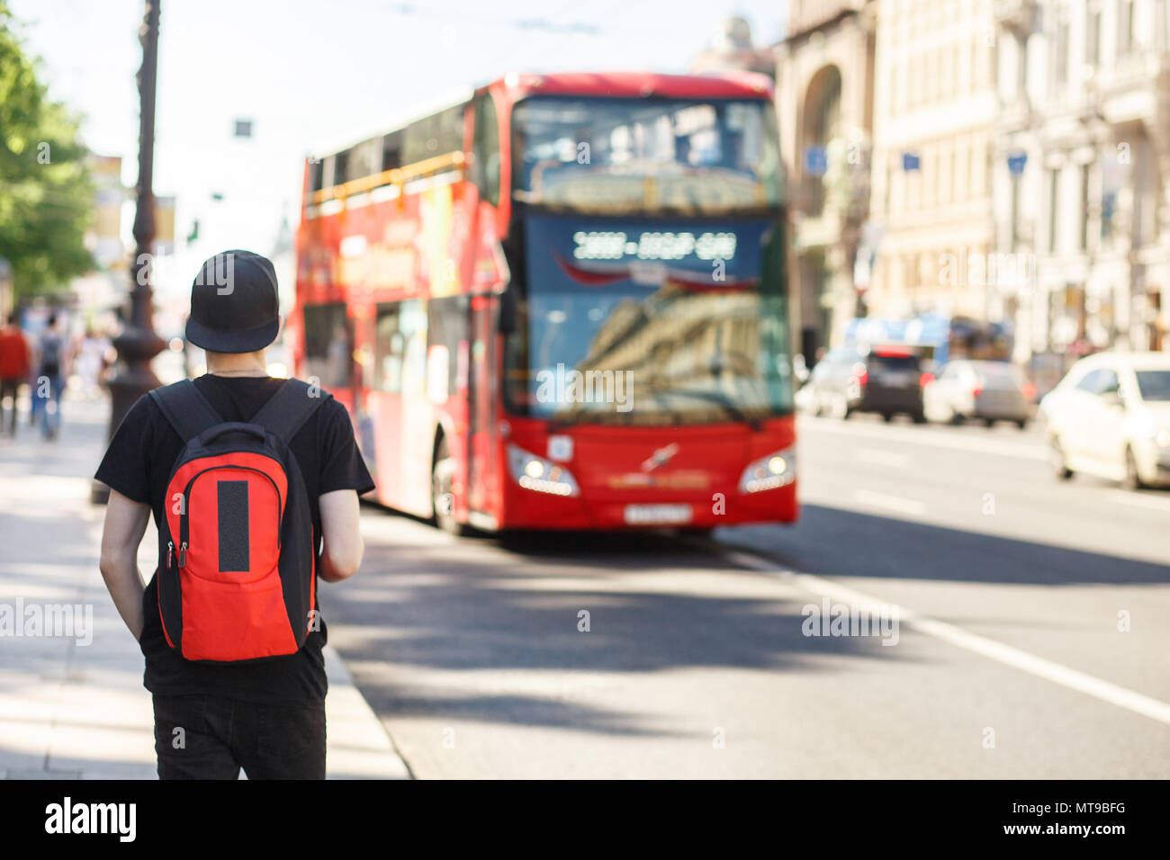 People, travel, tourism and education concept - stylish young man with ...