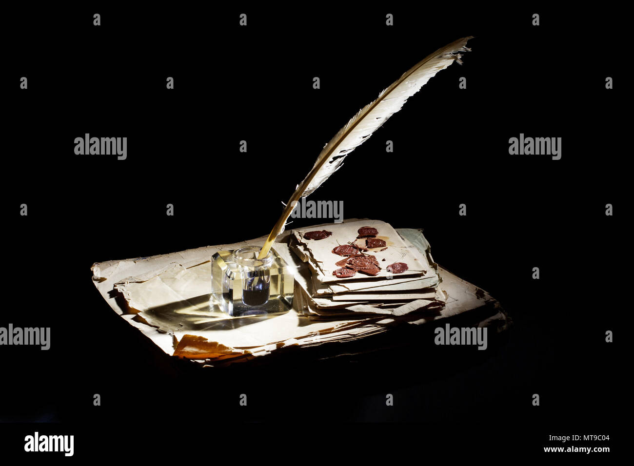 Old fountain pen, papers and inkwell on a black background Stock Photo ...