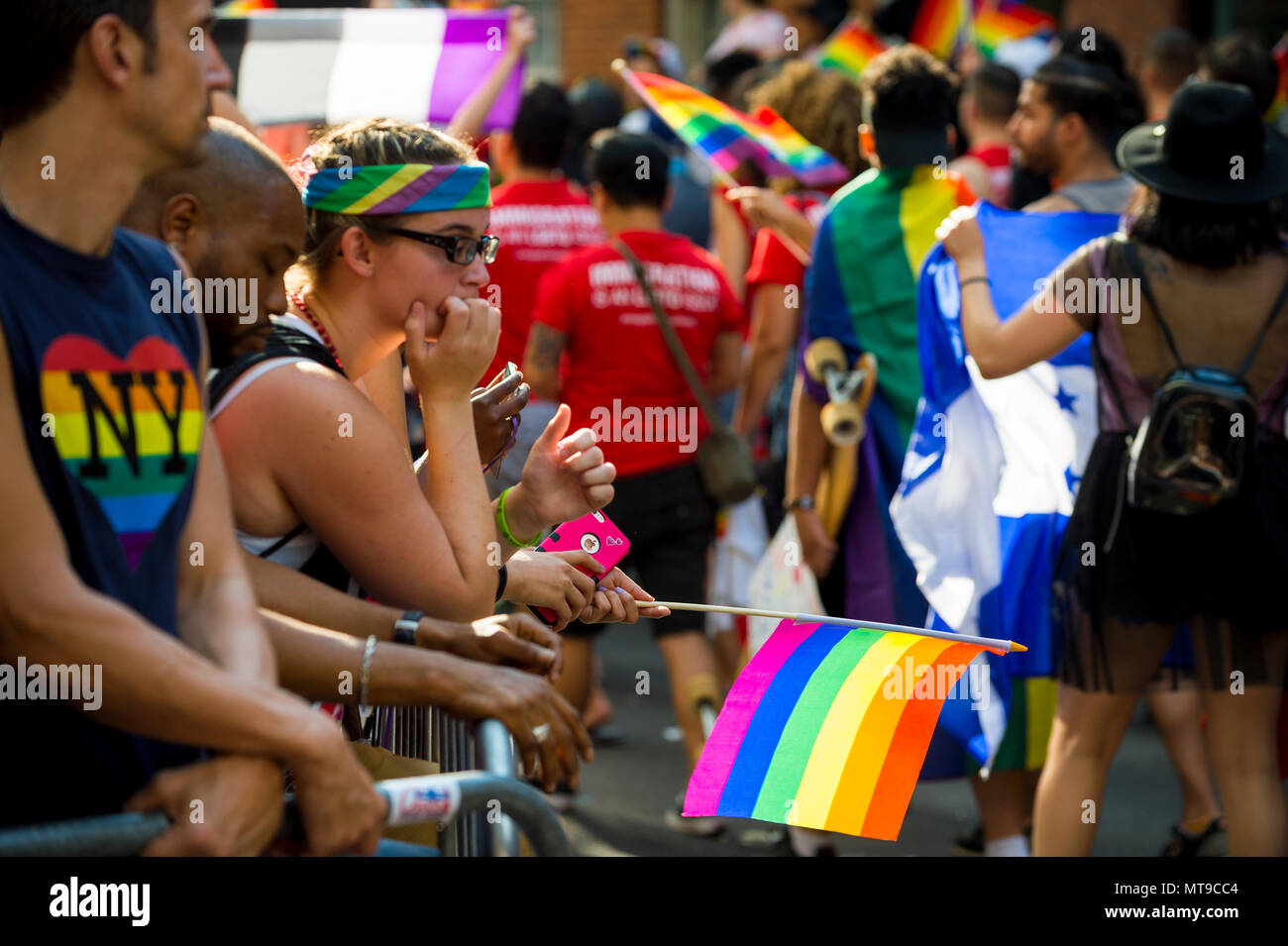 NEW YORK CITY - JUNE 25, 2017: Supporters wave rainbows flags on the ...