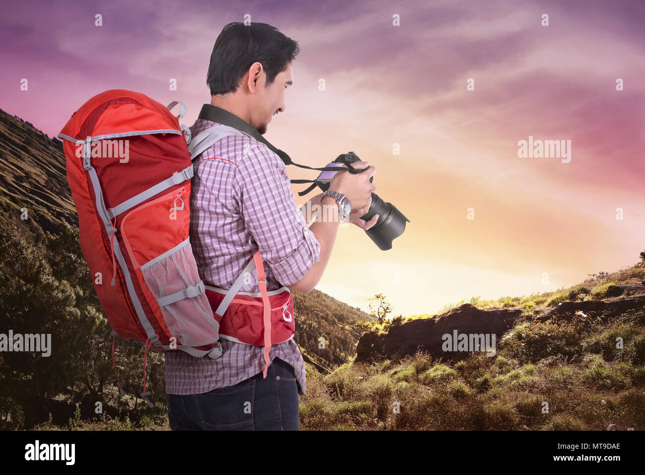 Happy asian photographer with his camera on the mountain Stock Photo ...