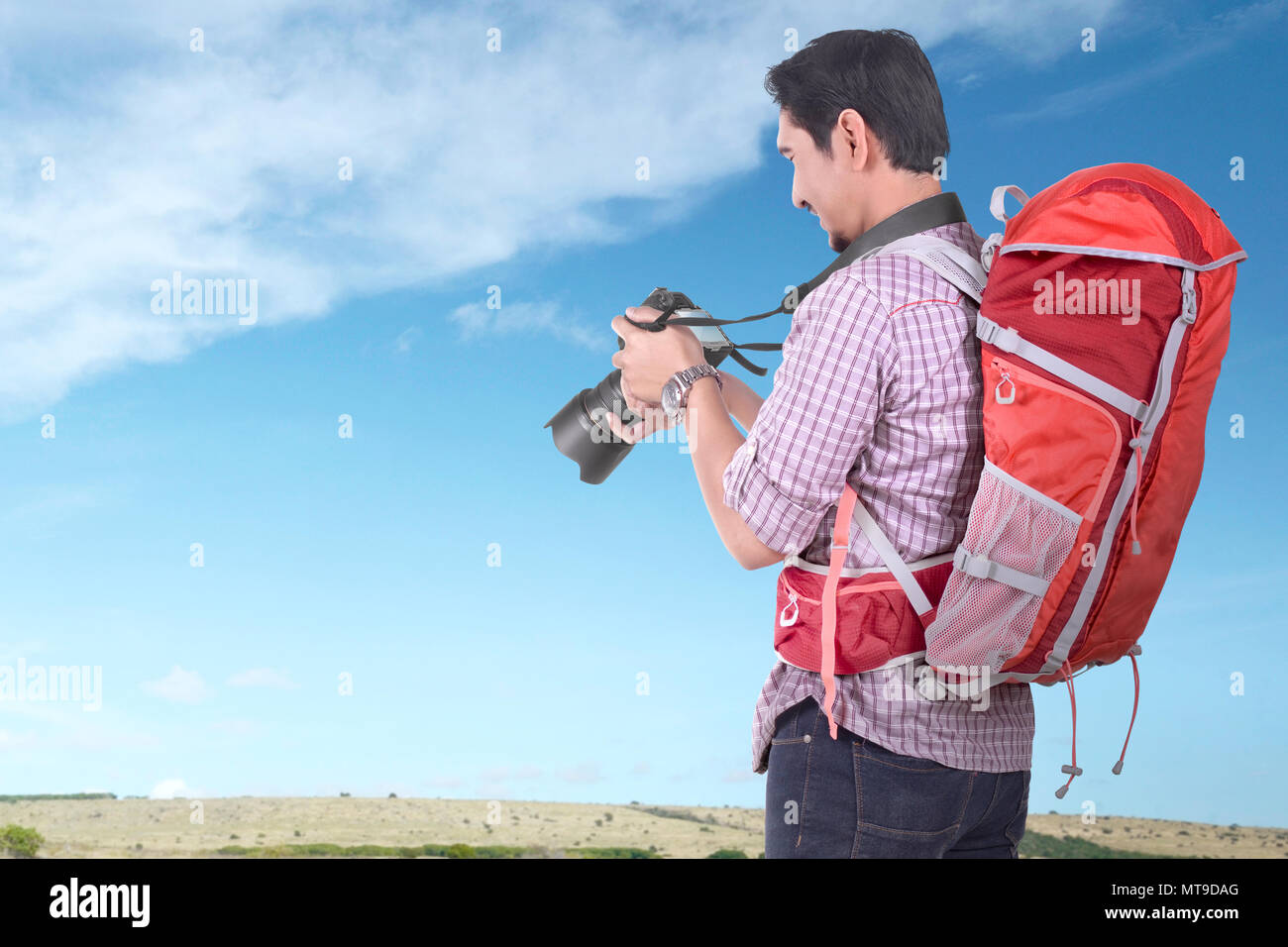 Asian traveler holding camera backpack hi-res stock photography and ...