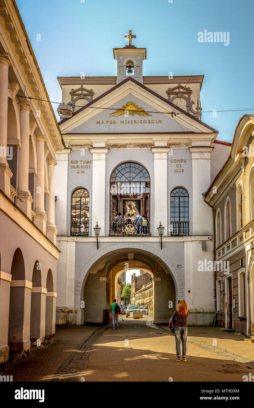 Woman take photo near the Gate of Dawn in Vilnius, Lithuania Stock ...