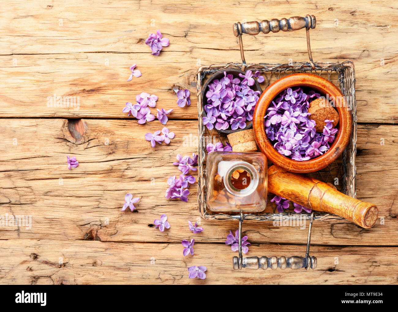 Bottle of essential extraction with lilac.Healing herbs.Alternative ...