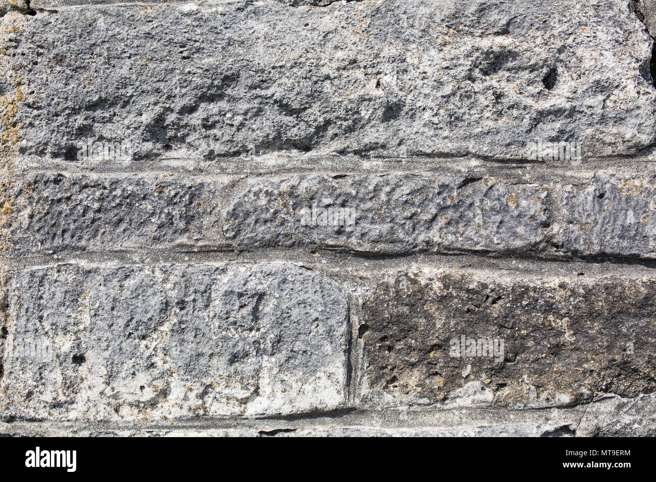 Old wall made of big stones and broken bricks. Vintage rough blocks ...