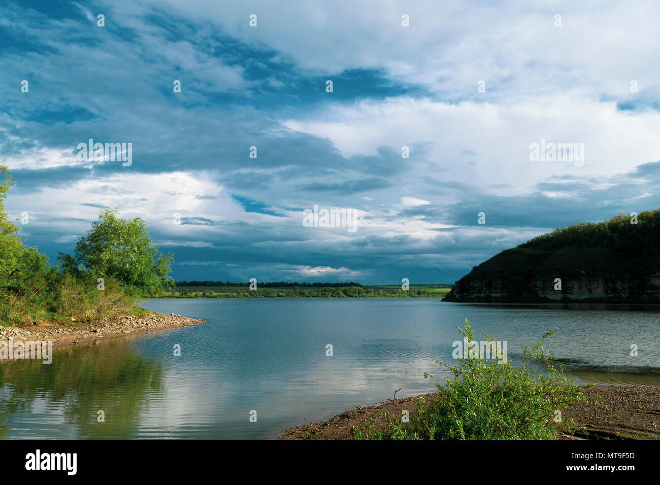 Beautiful river landscape. Calm river with colorful sky reflection on ...